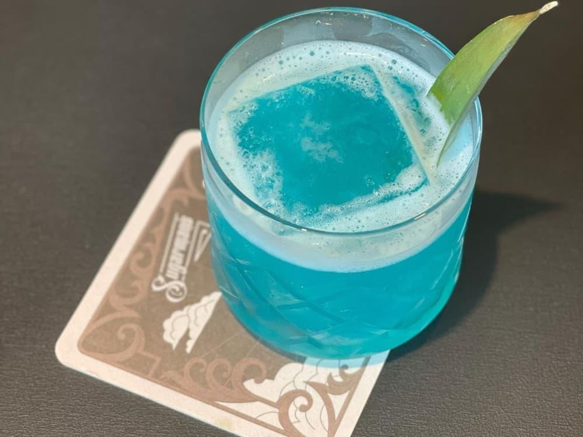 This pretty blue cocktail is called the Bluebird and has Tanqueray gin ...