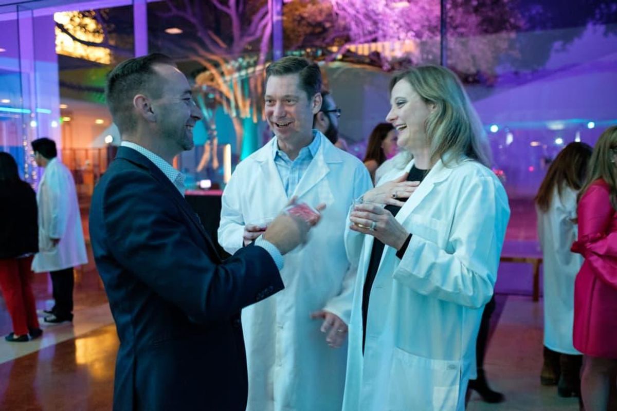 Guests don lab coats for the Mad Scientist Ball. - CultureMap Fort Worth